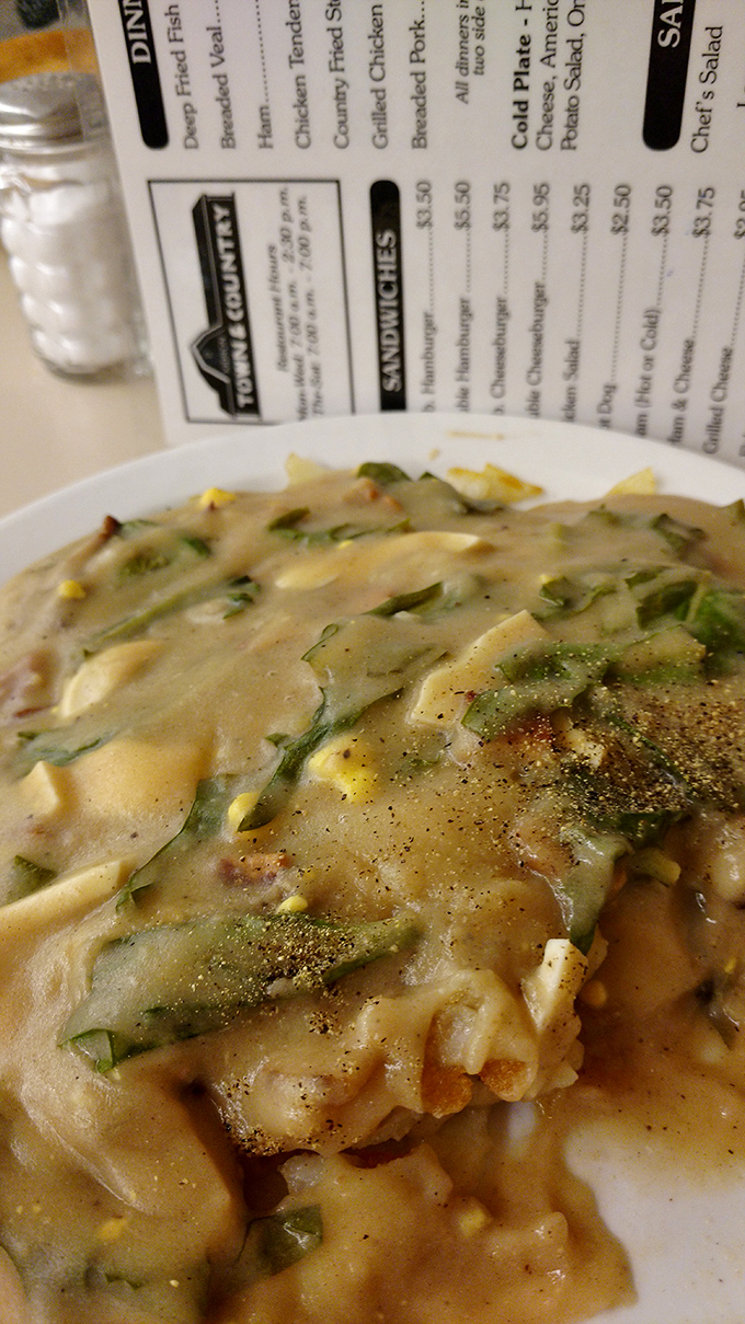 This isn't just gravy—it's a savory masterpiece with vegetables peeking through like hidden treasures. Comfort food that demands to be sopped up with bread.