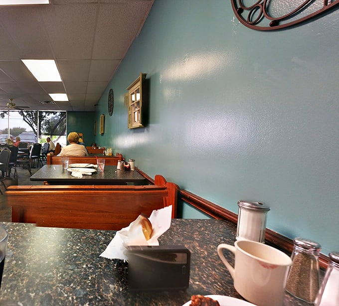 The teal walls and wooden booths aren't Instagram-bait—they're the backdrop to thousands of Richardson morning rituals.