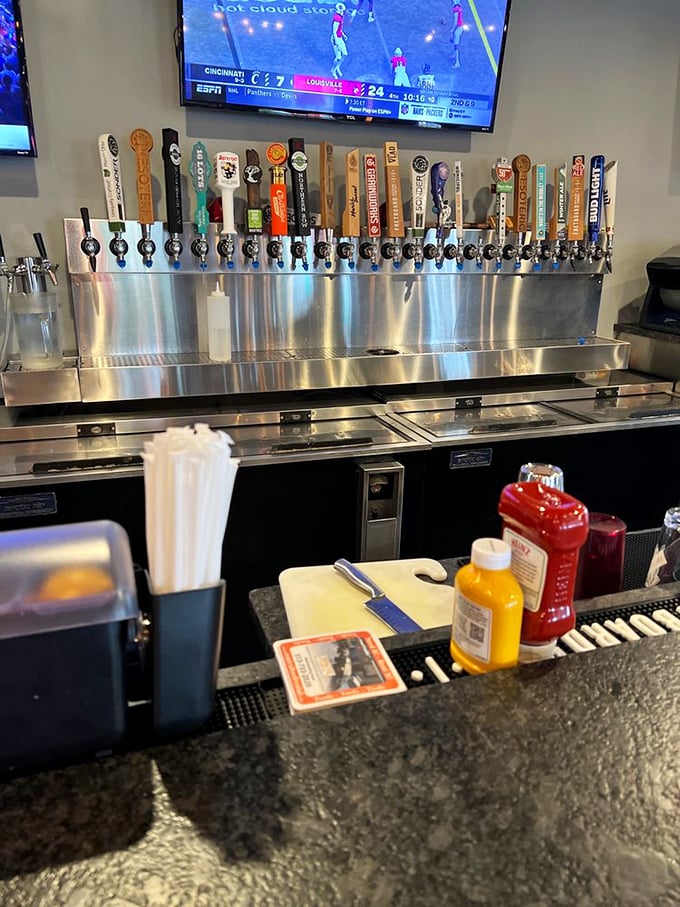 Beer taps lined up like soldiers ready for duty – a diverse army of craft brews waiting to complement whatever burger masterpiece you choose.