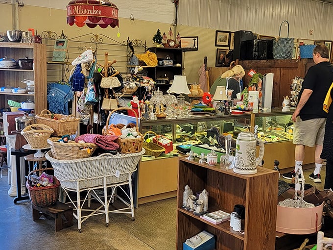 The organized chaos of collecting—wicker baskets, vintage glassware, and that one perfect lamp waiting to be discovered.