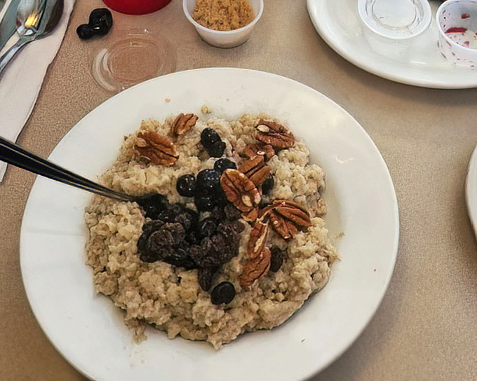 Oatmeal elevated from humble to heavenly with pecans and berries—proof that sometimes the healthiest choice can also be the most satisfying.