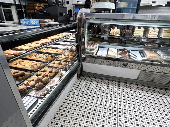 The pastry case—where willpower goes to die. Each cookie, rugelach, and danish sits like a carb-loaded work of art just waiting for your weakness.
