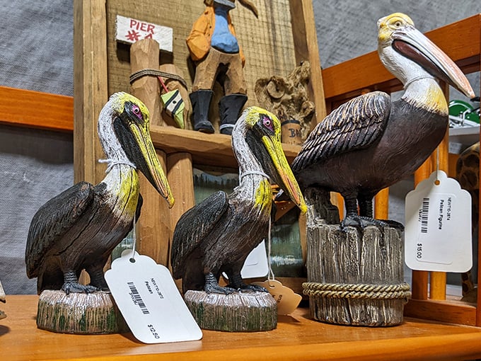 Florida's unofficial state birds—wooden pelicans perched and ready for adoption. These coastal sentinels are waiting to stand guard on someone's porch.