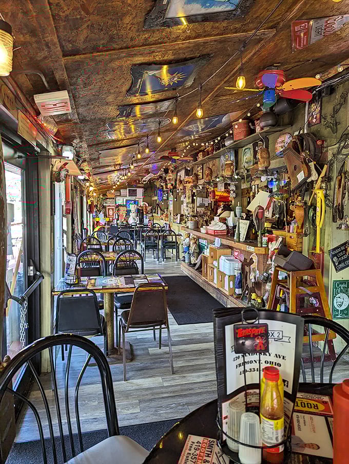 The dining area stretches before you like a gallery of American roadside culture—every table a front-row seat to decades of collected memories.