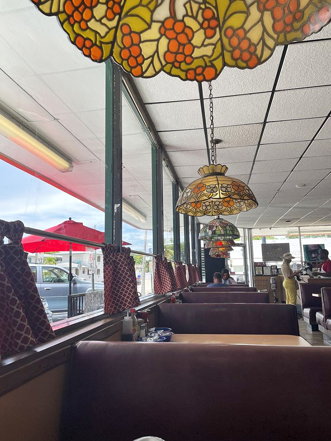 Stained glass lamps cast a warm glow over vinyl booths—Jimmy's doesn't need Instagram filters, it's been picture-perfect for decades.
