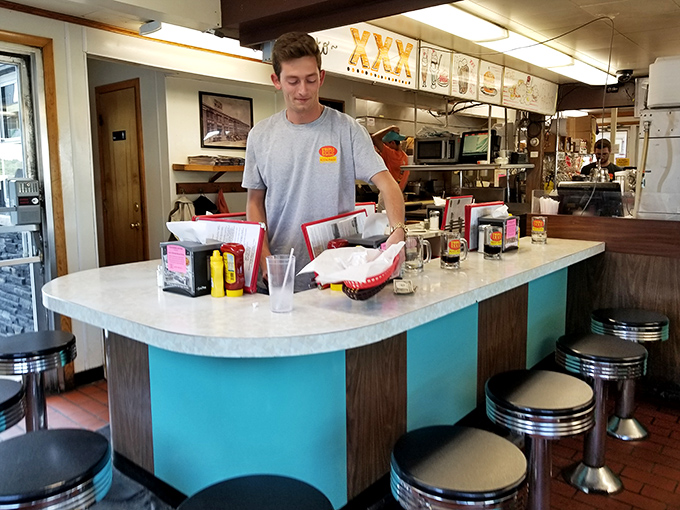 The unsung heroes of comfort food. These staff members aren't just serving meals—they're delivering memories, one perfectly assembled plate at a time.