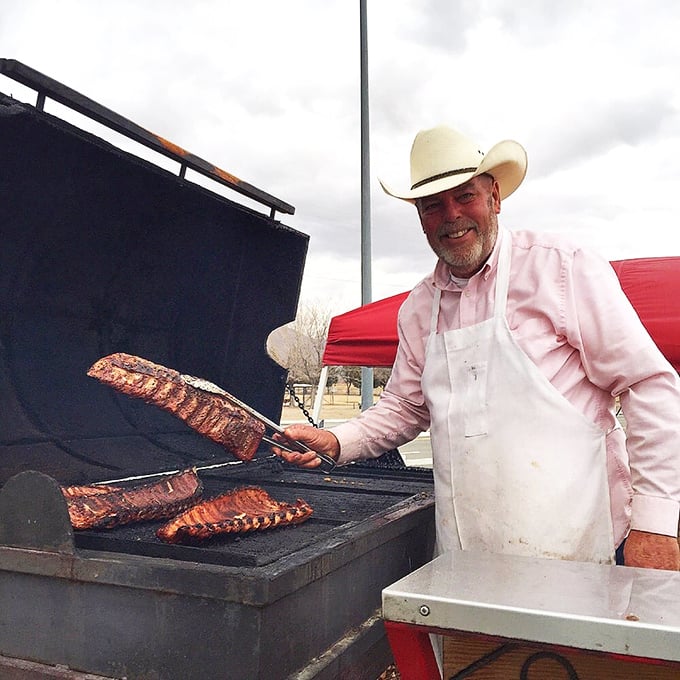 Behind every great barbecue is someone who understands the sacred relationship between fire, meat, and patience—a pitmaster in their natural habitat.