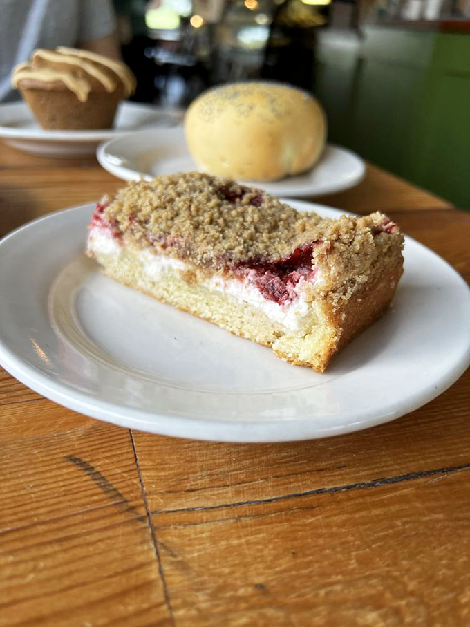 Layer upon layer of cake, cream, and berry goodness—like a geological formation you'd happily climb with nothing but a fork.