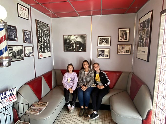 The cozy booth area features vintage photographs that tell stories of yesteryear, creating the perfect backdrop for making your own memories over comfort food.