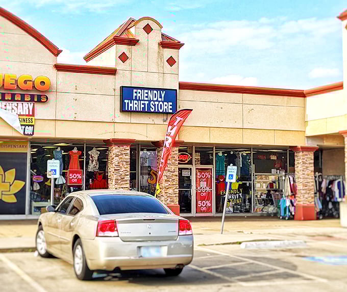 Friendly Thrift Store's sign pops against the stone and tan exterior. A welcoming facade for a welcoming shopping experience.