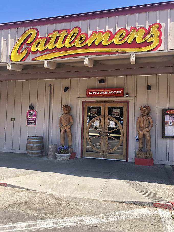 The bright yellow Cattlemen's sign shines against the building like a gold badge of honor earned through decades of beef excellence.