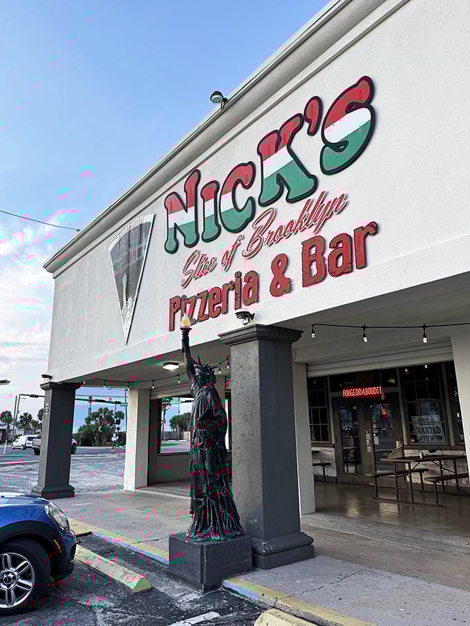 The red, white and green sign at Nick's isn't just patriotic – it's a promise of authentic New York pizza on Panama City Beach.