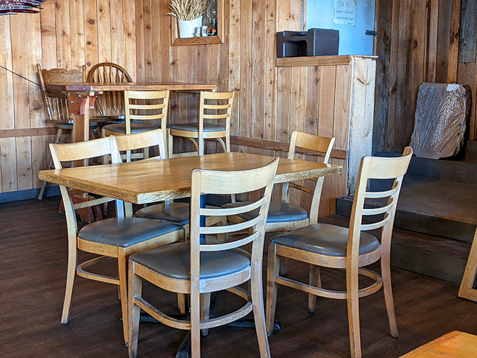 Wooden chairs and tables arranged with care—not for Instagram, but for actual humans to gather, eat, and share stories.