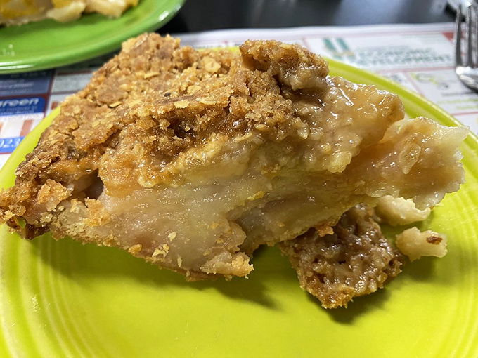 Apple pie so homemade it practically whispers family secrets—with a crust that crumbles just right between fork and plate.