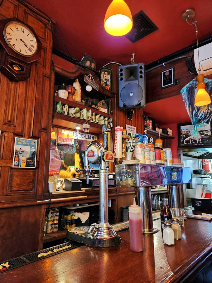 Behind every great pub is a bar that tells stories—this one with its vintage clock, amber lighting, and taps ready to pour liquid comfort.
