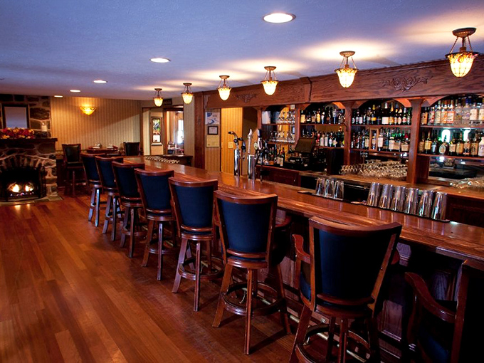 A bar that Hemingway would approve of—gleaming wood, amber lighting, and the promise of stories waiting to unfold over perfectly poured drinks.