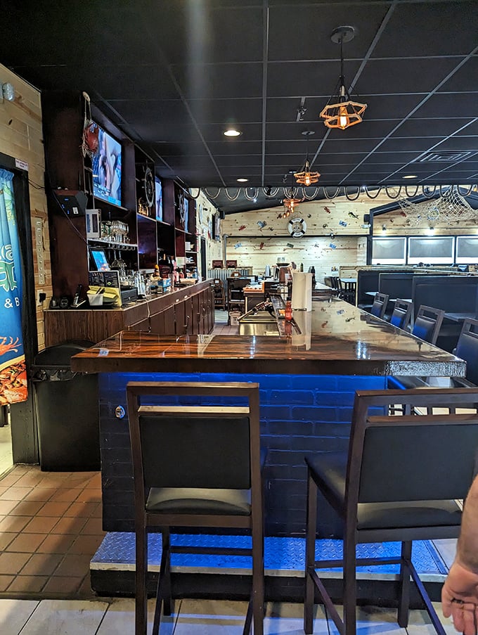 Blue lighting under the bar creates an underwater glow, as if the drinks are being served from Atlantis itself.