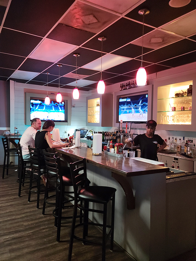 The bar area strikes that perfect balance: casual enough for post-beach drinks, nice enough for date night. Those pendant lights add just the right touch.