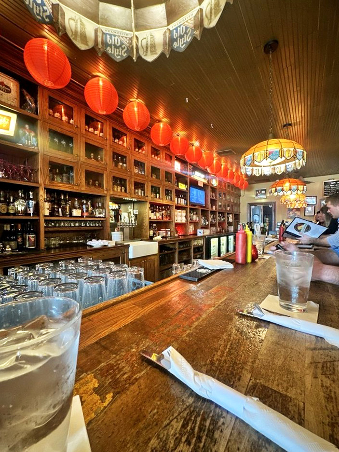 The bar isn't just serving drinks; it's preserving history. Those red lanterns aren't decoration – they're beacons guiding thirsty travelers home.