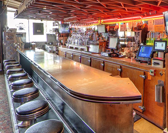 The bar counter stretches invitingly with its row of stools – the perfect perch for solo diners or those seeking breakfast with a side of conversation.