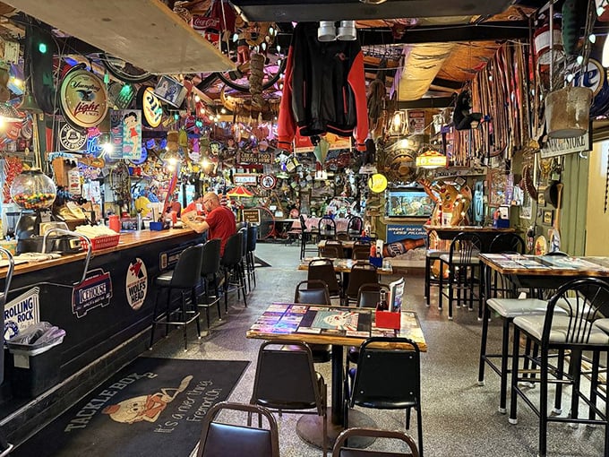 The bar area doesn't just serve drinks; it serves history—one beer sign, fishing lure, and conversation at a time.