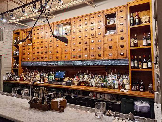 The Apothecary bar in back cleverly transforms the building's pharmaceutical past into cocktail present—where "take with food" is still sound advice.