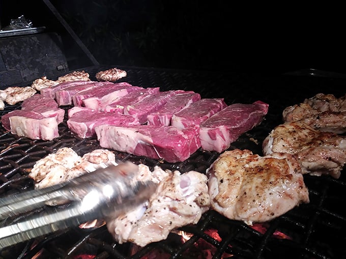 Watch the magic happen as steaks sizzle over open flames, turning raw potential into pure perfection.