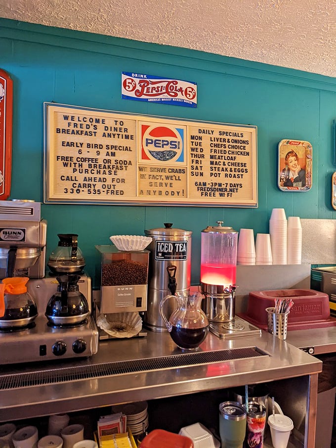 The beverage station tells you everything about Fred's priorities: coffee first, everything else second. That vintage signage speaks volumes.