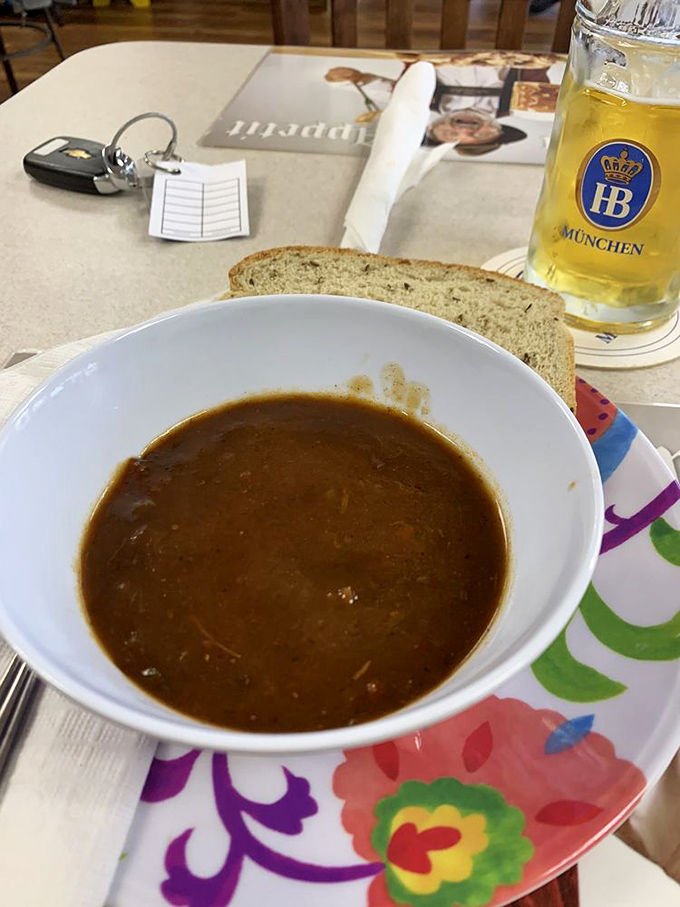 A soulful bowl of goulash soup with a slice of bread standing by for dipping duty. German penicillin that cures whatever ails you.