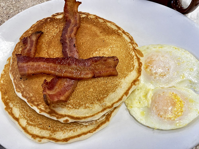 Pancakes that could double as pillows, bacon standing at attention, and sunny-side-up eggs. This is what breakfast looked like before Instagram existed.