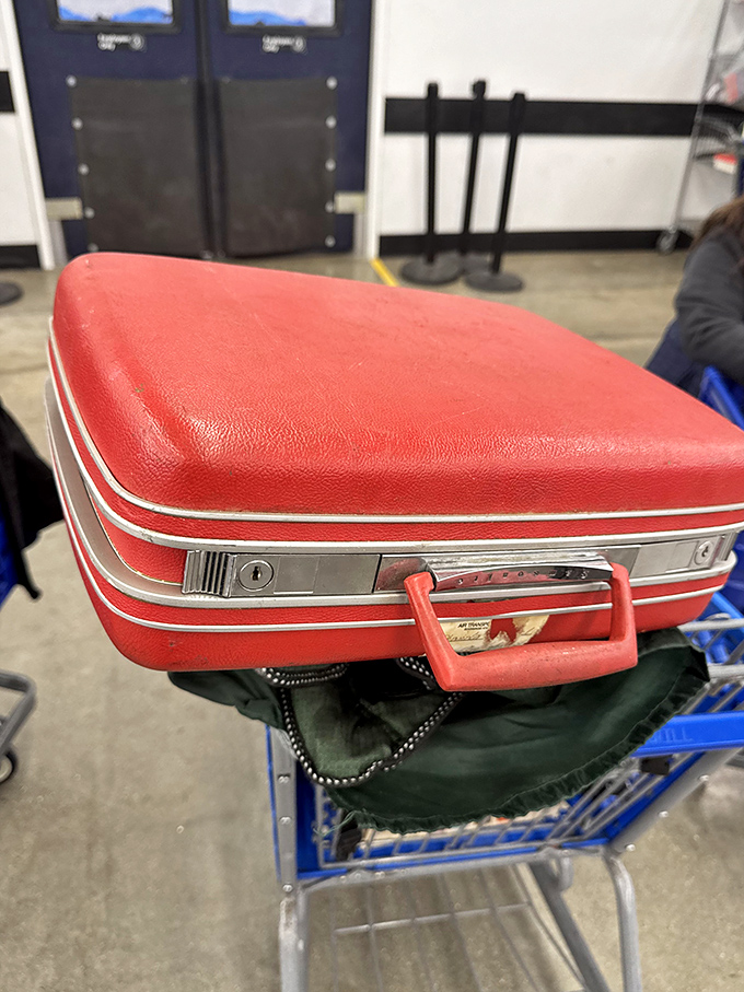 This vintage red suitcase has stories to tell—of road trips taken and adventures postponed, now waiting for its next chapter.