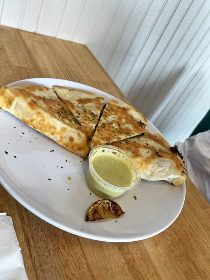 The brisket quesadilla – proof that cultural fusion isn't just a good idea, it's a moral imperative for your taste buds.
