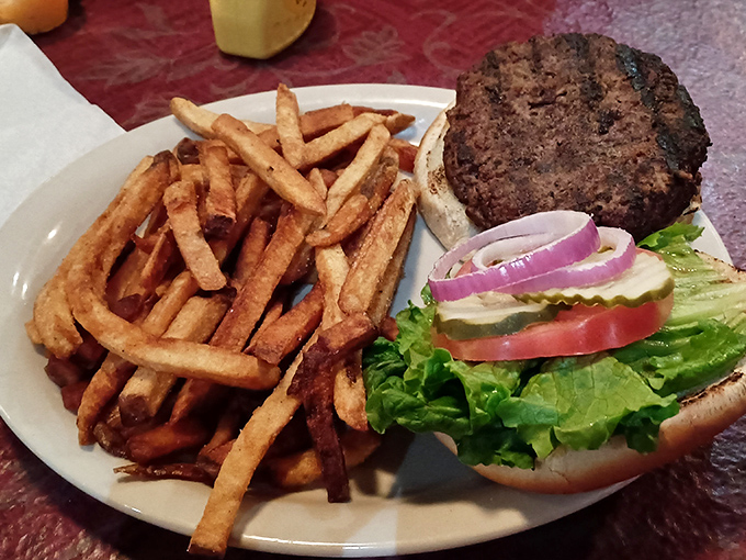 This burger doesn't need pretentious toppings or artisanal buns—it's the straightforward handshake of sandwiches, promising honest flavor with every bite.