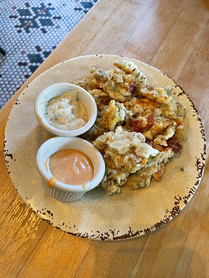Crispy, golden cheese curds served with house-made dipping sauces—the kind of appetizer that makes you reconsider sharing with your table.