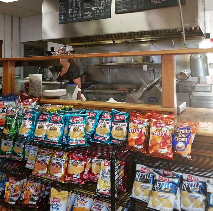 The chip display – where good intentions about "just having a sandwich" go to die amid the siren call of crunchy potato perfection.