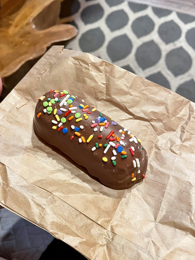 The chocolate-covered Twinkie—proof that even classics can be improved. This sprinkle-topped creation is childhood nostalgia in formal attire.