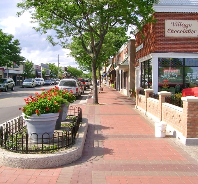 East Tawas' downtown sidewalks bloom with colorful planters and inviting storefronts. The Village Chocolatier tempts passersby with sweet treasures that make diets seem like terrible ideas.