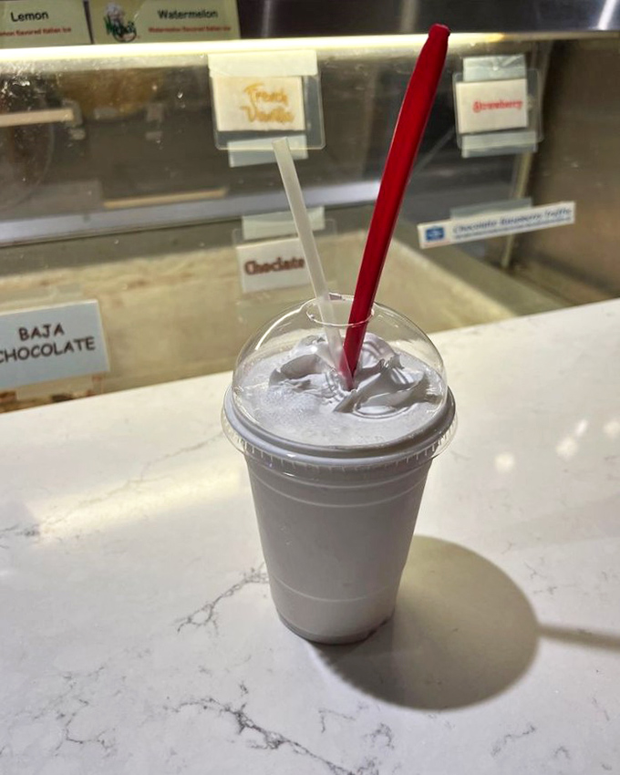 Layers of chocolate and coffee swirl hypnotically, topped with whipped cream—the kind of drink that demands to be photographed before consumed.