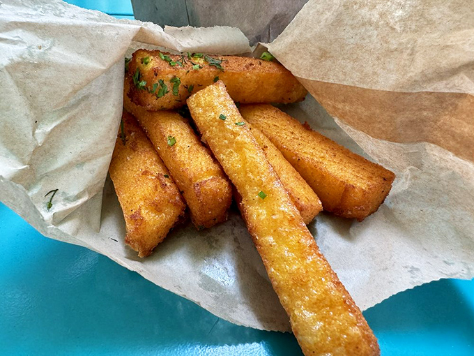 These aren't just fries—they're cornmeal-crusted magic wands that transform ordinary mornings into extraordinary ones. Crispy, golden, and utterly irresistible.