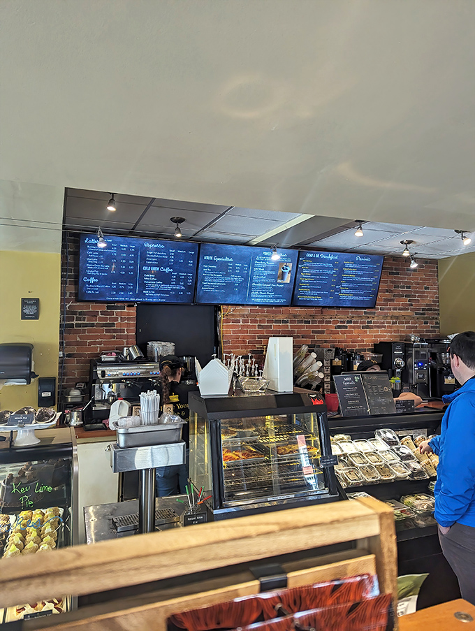 The counter view reveals the command center of culinary operations. Those menu boards aren't just lists—they're treasure maps to flavor country.