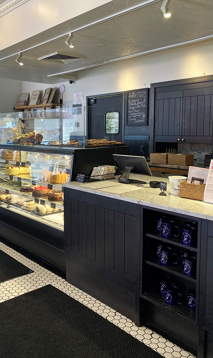 The display case—where diet plans go to die and happiness is measured in layers of pastry, cream, and chocolate.