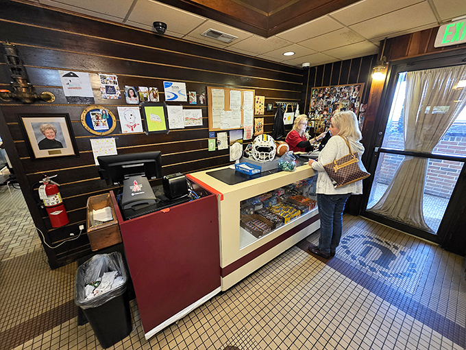 The front counter serves as command central for this culinary operation—where first-timers learn the ropes and regulars exchange knowing nods.