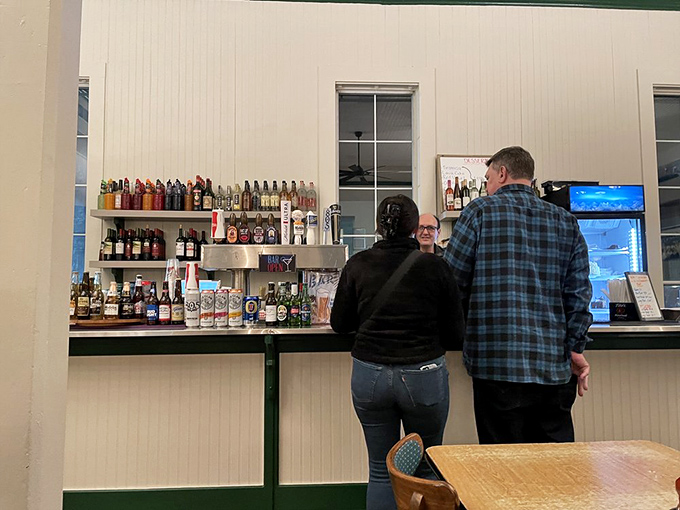 The ordering counter – where seafood dreams begin and difficult decisions must be made. That giant fish overhead? He's seen it all, including your indecision.