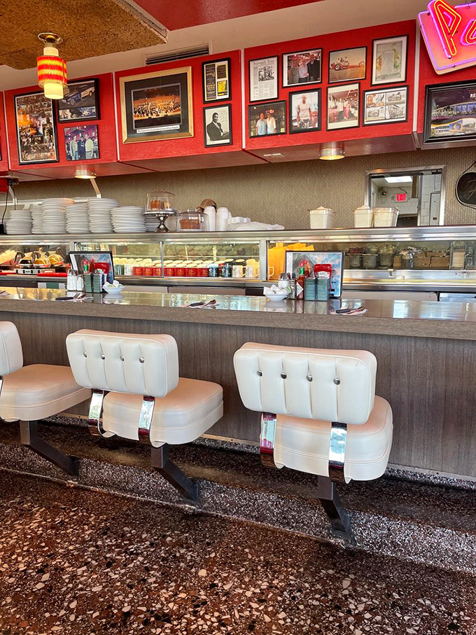 The counter—where solo diners become temporary neighbors and the choreographed dance of short-order cooking unfolds like theater.
