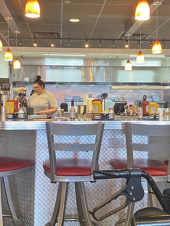 Counter seats that put you front-row for the cooking show, with diamond-plate metal adding industrial chic to your breakfast experience.