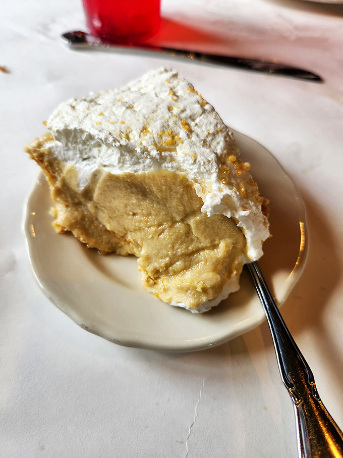 Cream pie that defies physics – somehow both light as air and substantially satisfying. The kind of dessert that ruins you for all other desserts.