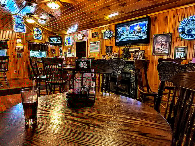 Beer signs provide a neon glow against the wooden backdrop, creating that perfect "I've discovered something authentic" atmosphere every food traveler craves.