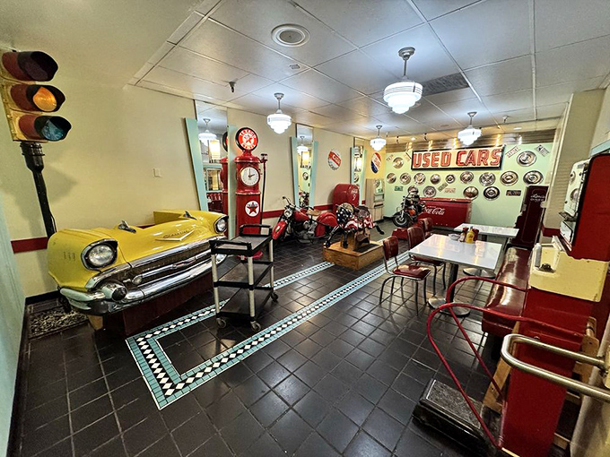 The decor doesn't just nod to the 1950s – it bear hugs the era with vintage cars, traffic lights, and enough nostalgia to power a time machine.