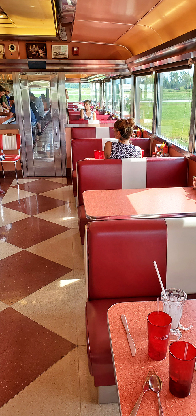 The checkered floor leads your eye down a runway of red and white booths. Sunlight streams in, illuminating conversations that range from "How's the bisque?" to "How's your life?"