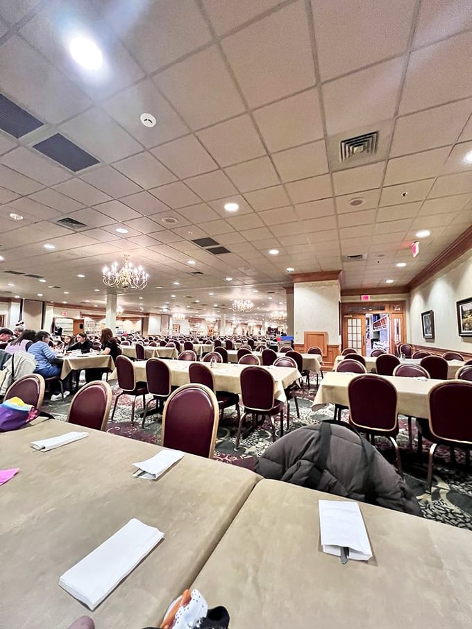 The dining room stretches toward the horizon, a sea of tables where countless family celebrations and first dates have unfolded under gentle chandelier light.